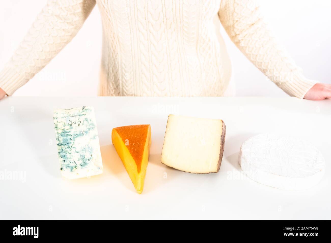 Variety of large wedges gourmet cheese on a white background Stock ...