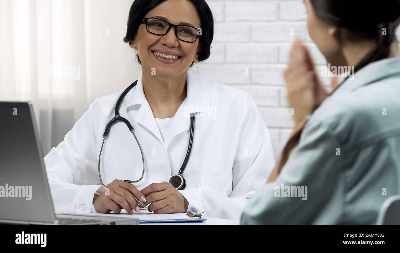 Female physician informing young woman hi-res stock photography and ...