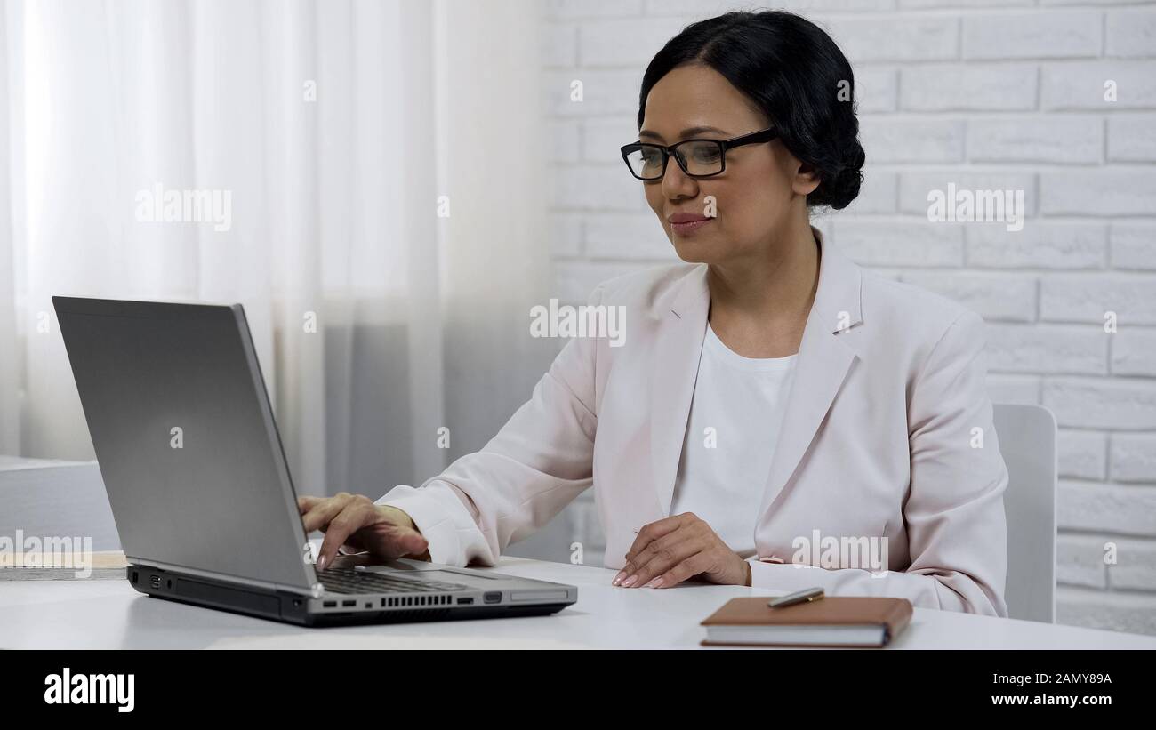 Asian business lady typing on laptop, beginning startup, successful ...