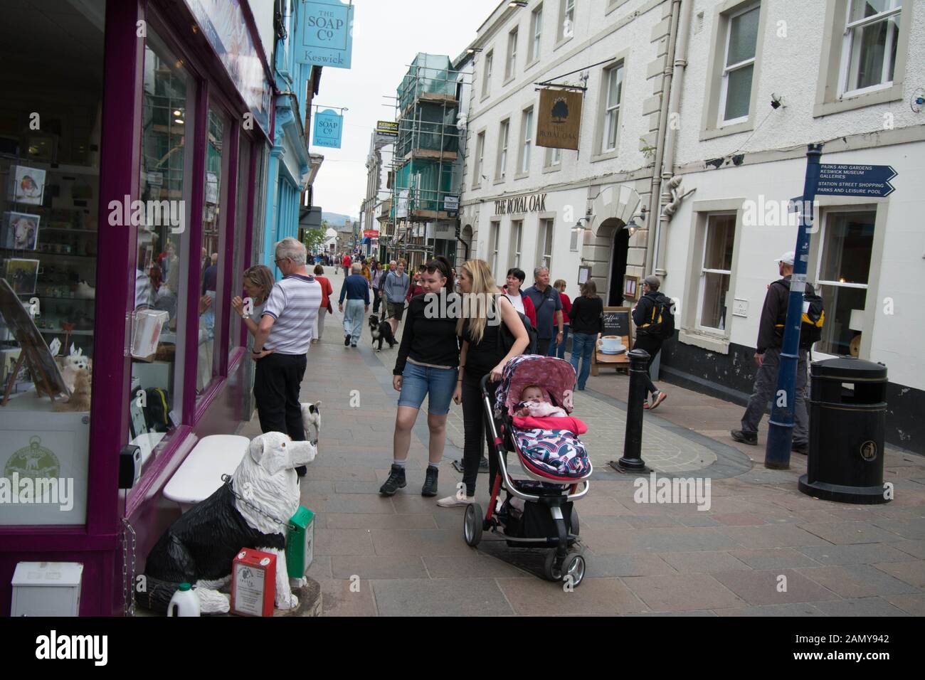 Keswick the Lake District UK baby in pram and dog statue dog sign signs ...