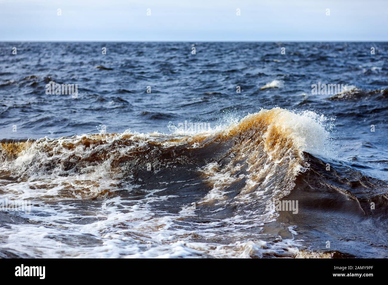 Red wave splash in the Baltic in summer Stock Photo - Alamy