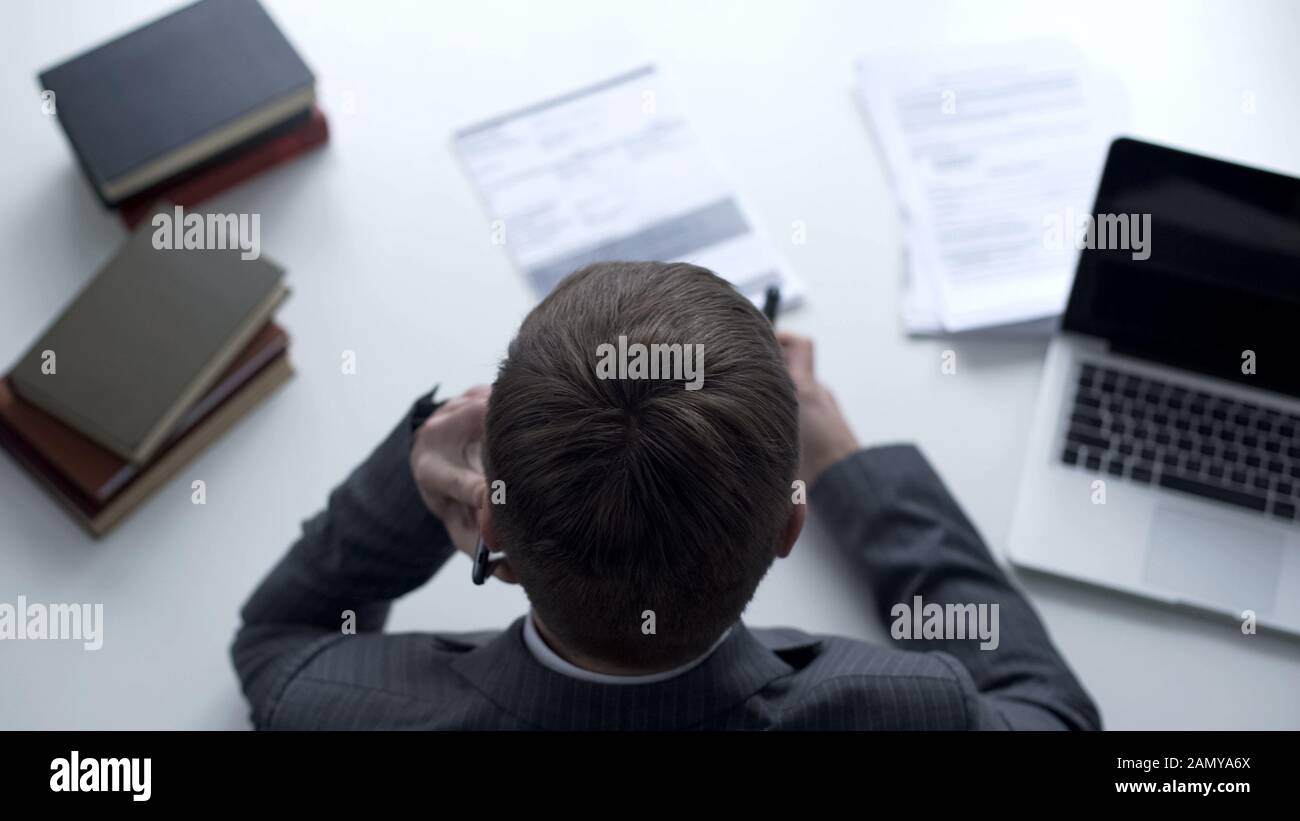 Lawyer providing advice by phone, correcting investigation report, top ...
