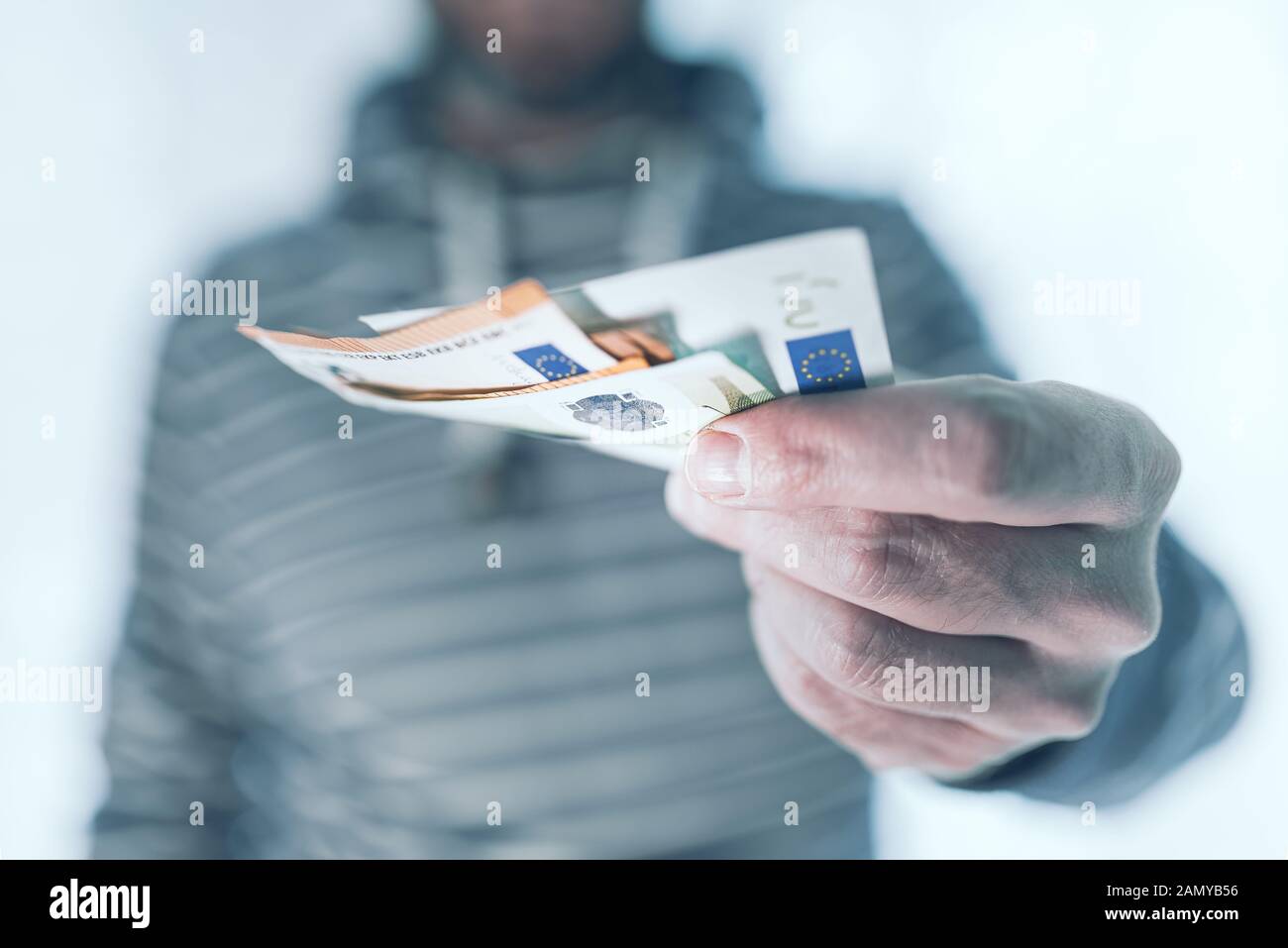 Handing over money hi-res stock photography and images - Alamy