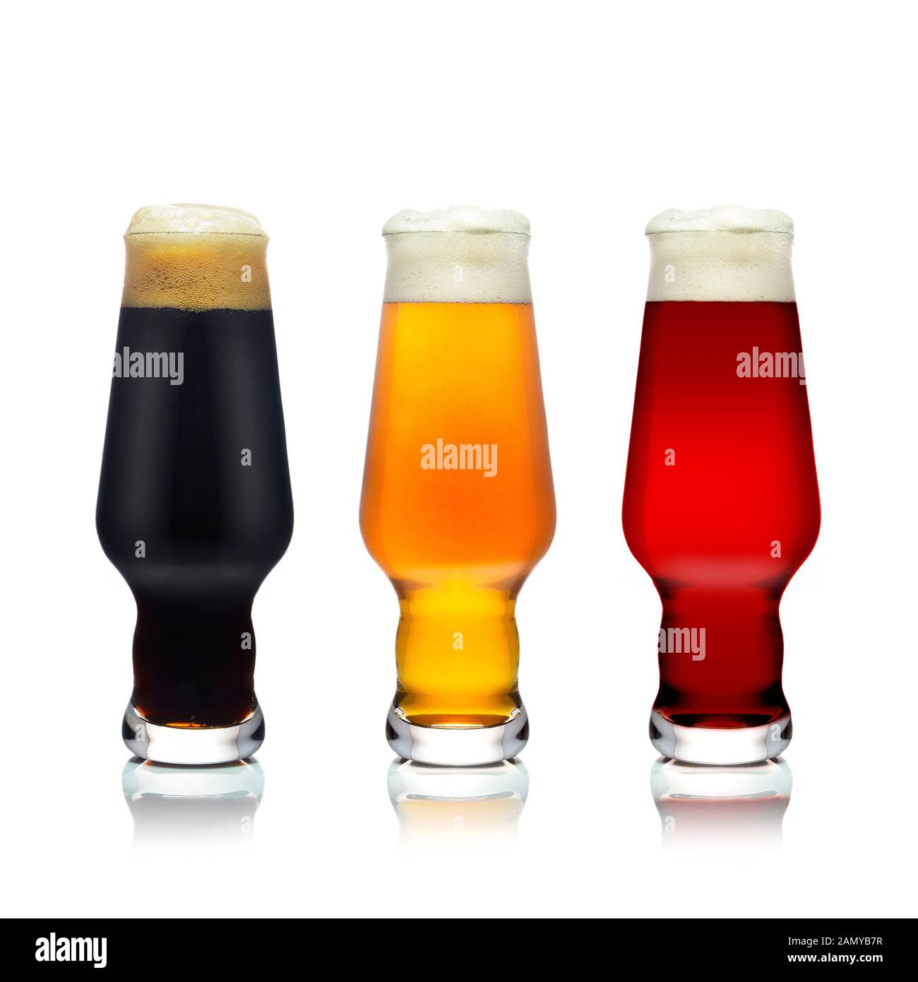 Three glasses of dark, light and red beer on a white background ...