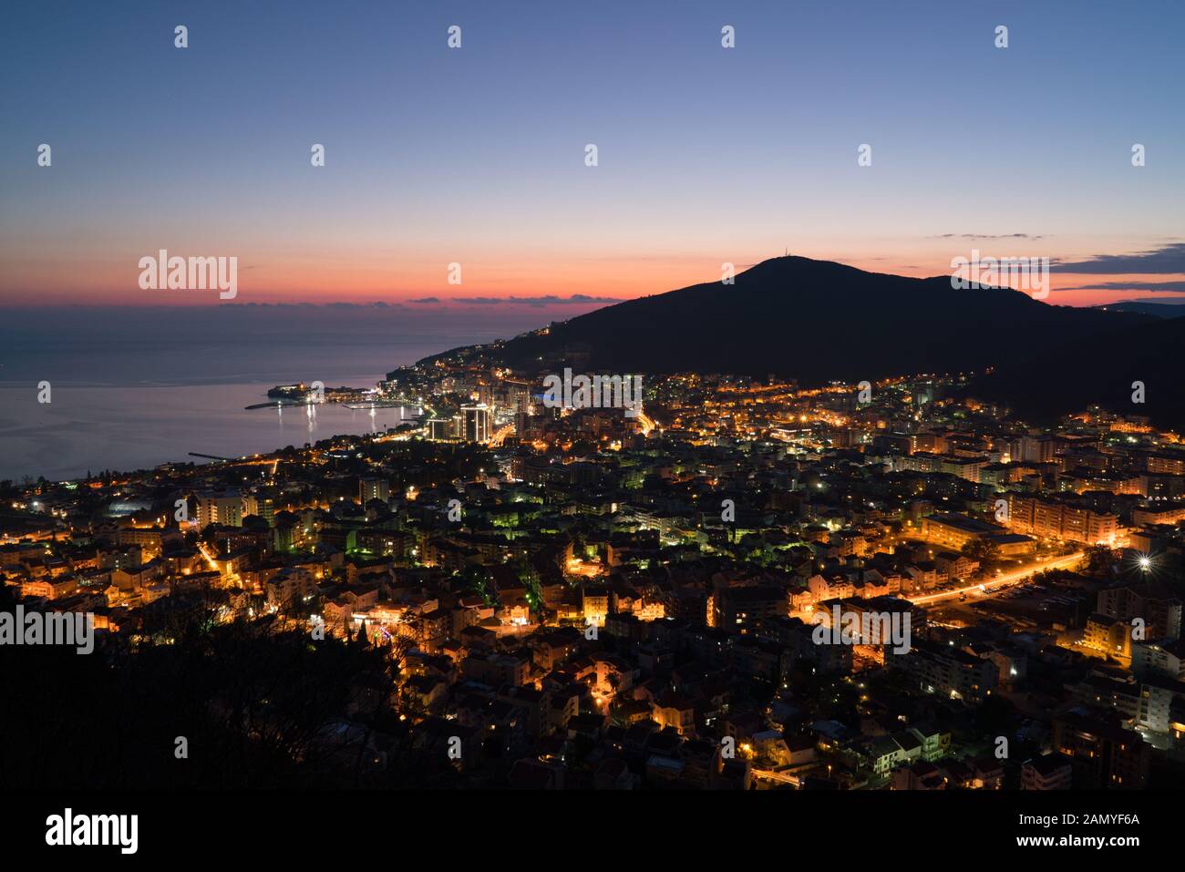 view of Budva city lights at night Stock Photo - Alamy