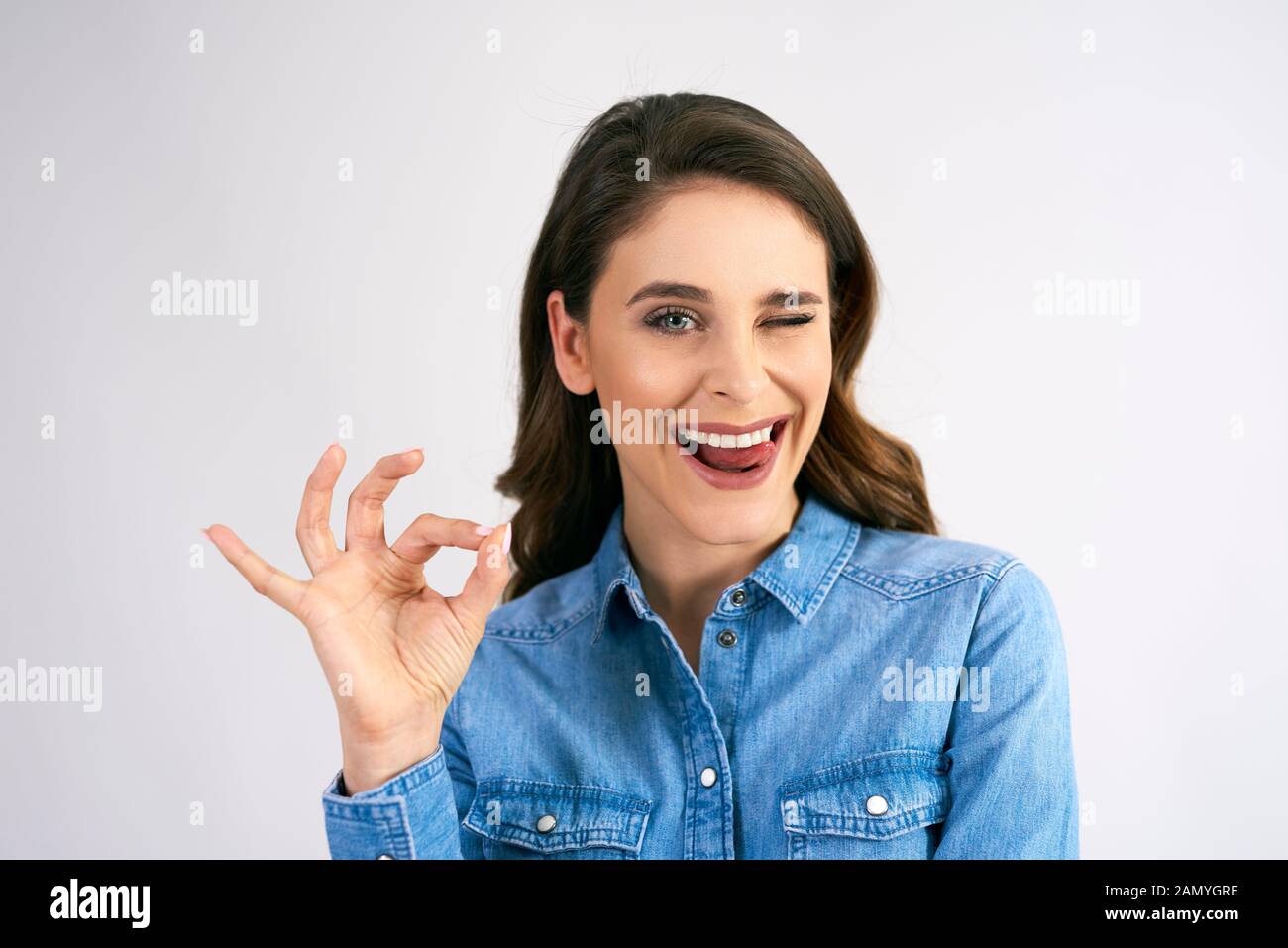Winking gesture hi-res stock photography and images - Alamy