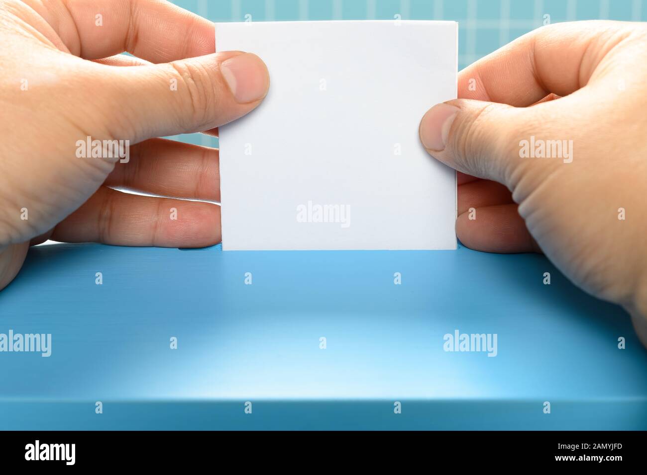 man inserting his ticket to a vote box Stock Photo - Alamy