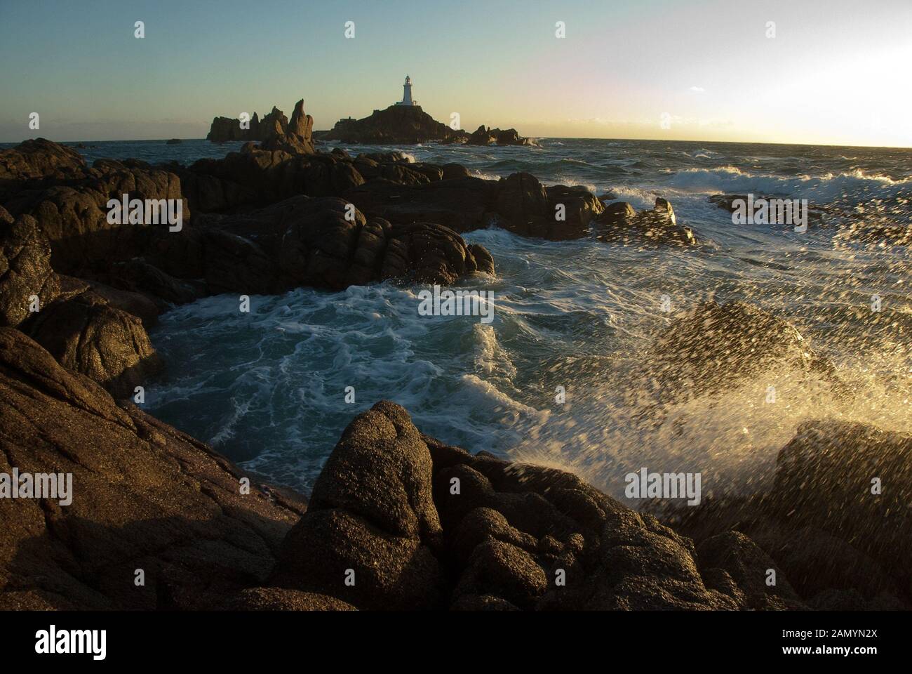 Lighthouse la corbiere on jersey at sunset hi-res stock photography and ...