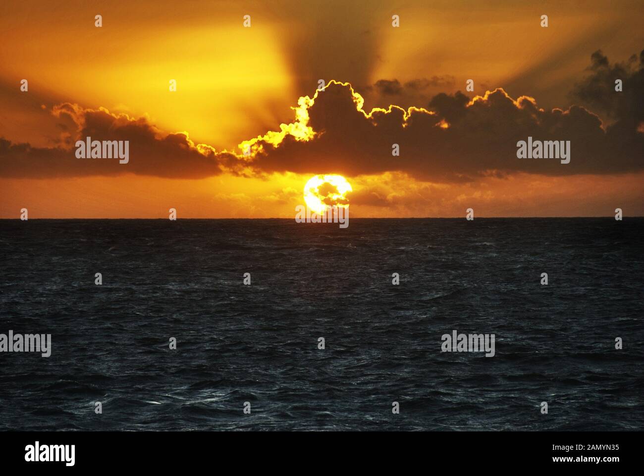 Sunset at sea with clouds off coast of Jersey Channel Islands UK Stock ...