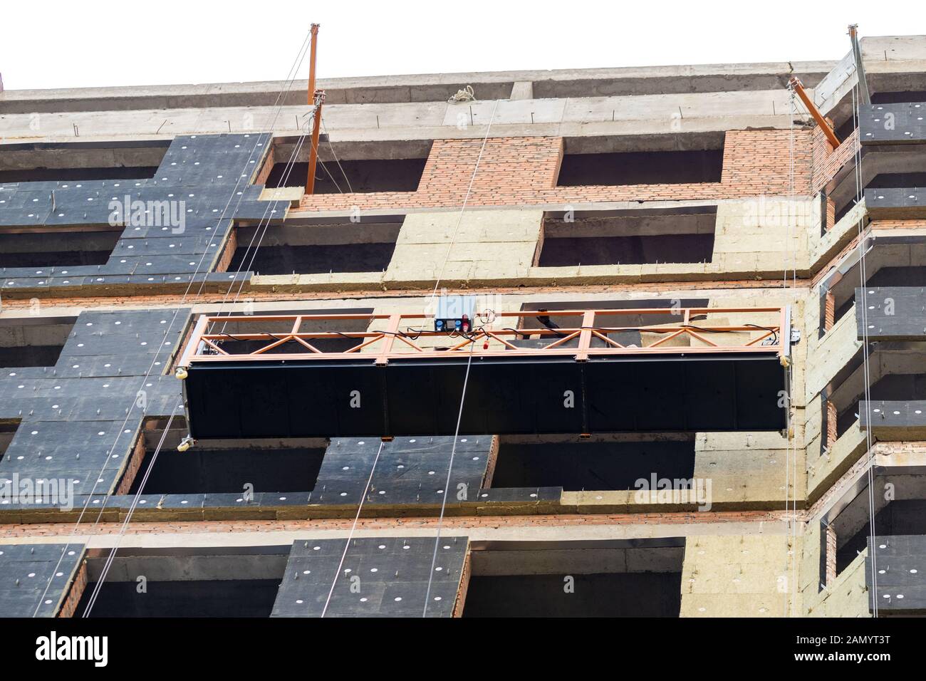 Suspended construction craddle near wall of hightower residentaial ...