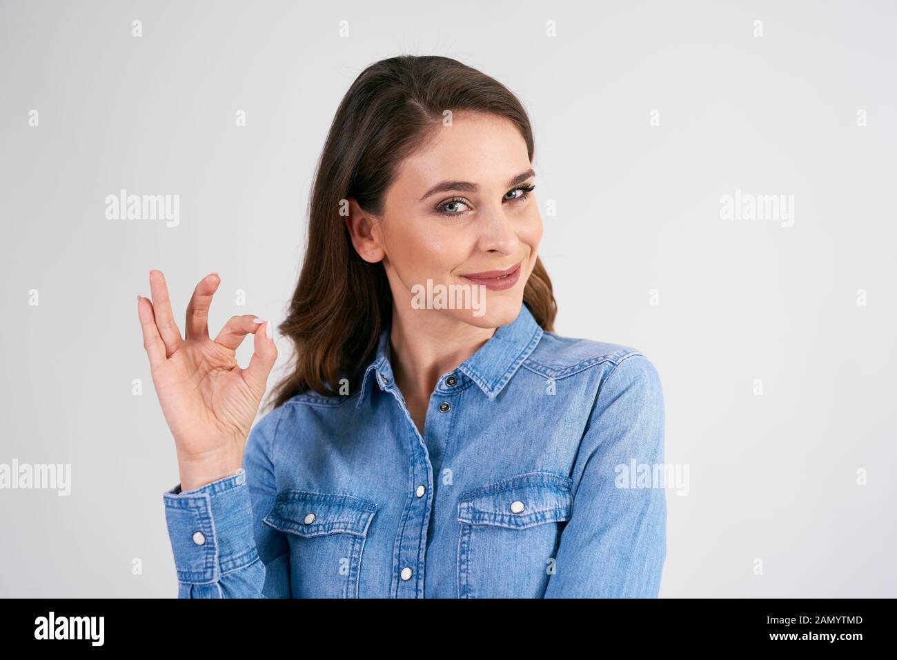 Woman smiling positive gesture in hi-res stock photography and images ...