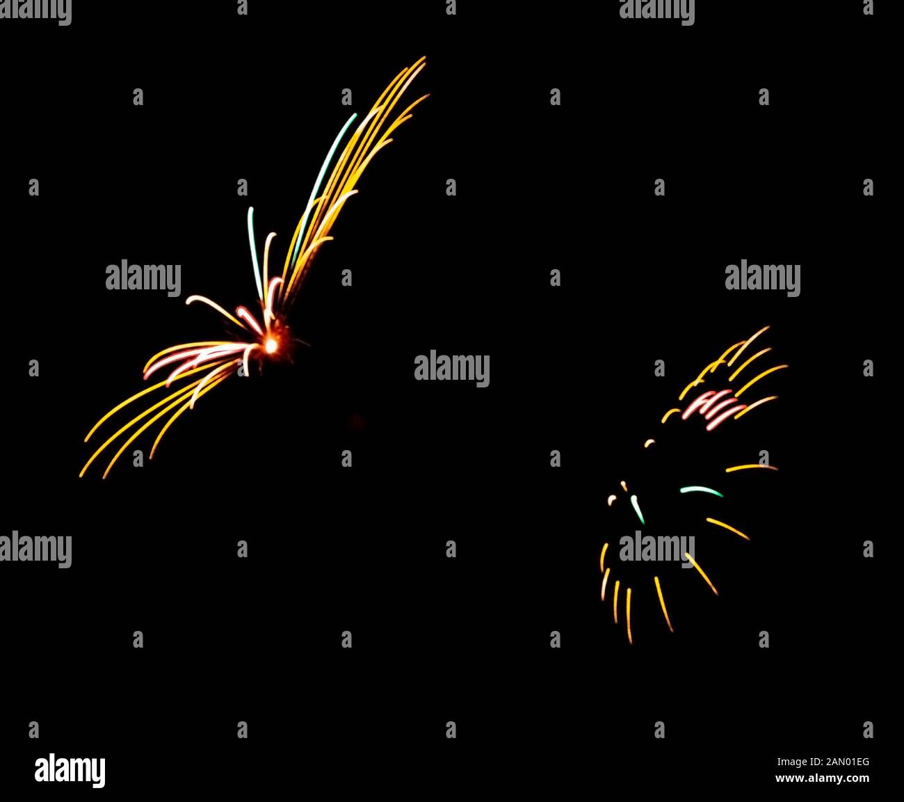 Fireworks explode in the black sky leaving room for copy print between ...