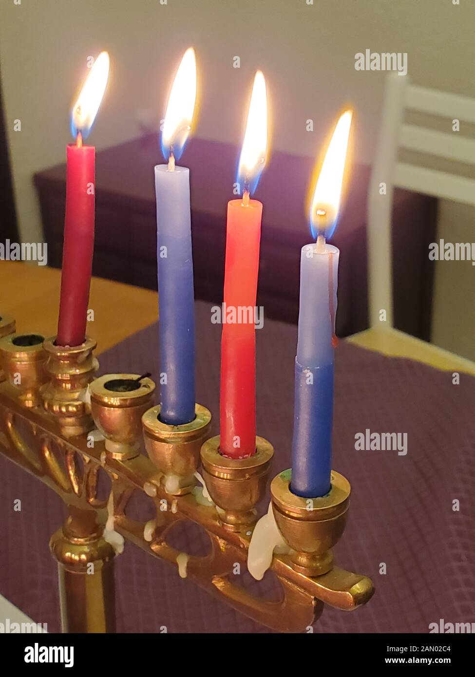 Close-up of Jewish Chanukah (Hanukkah) menorah with several colorful ...