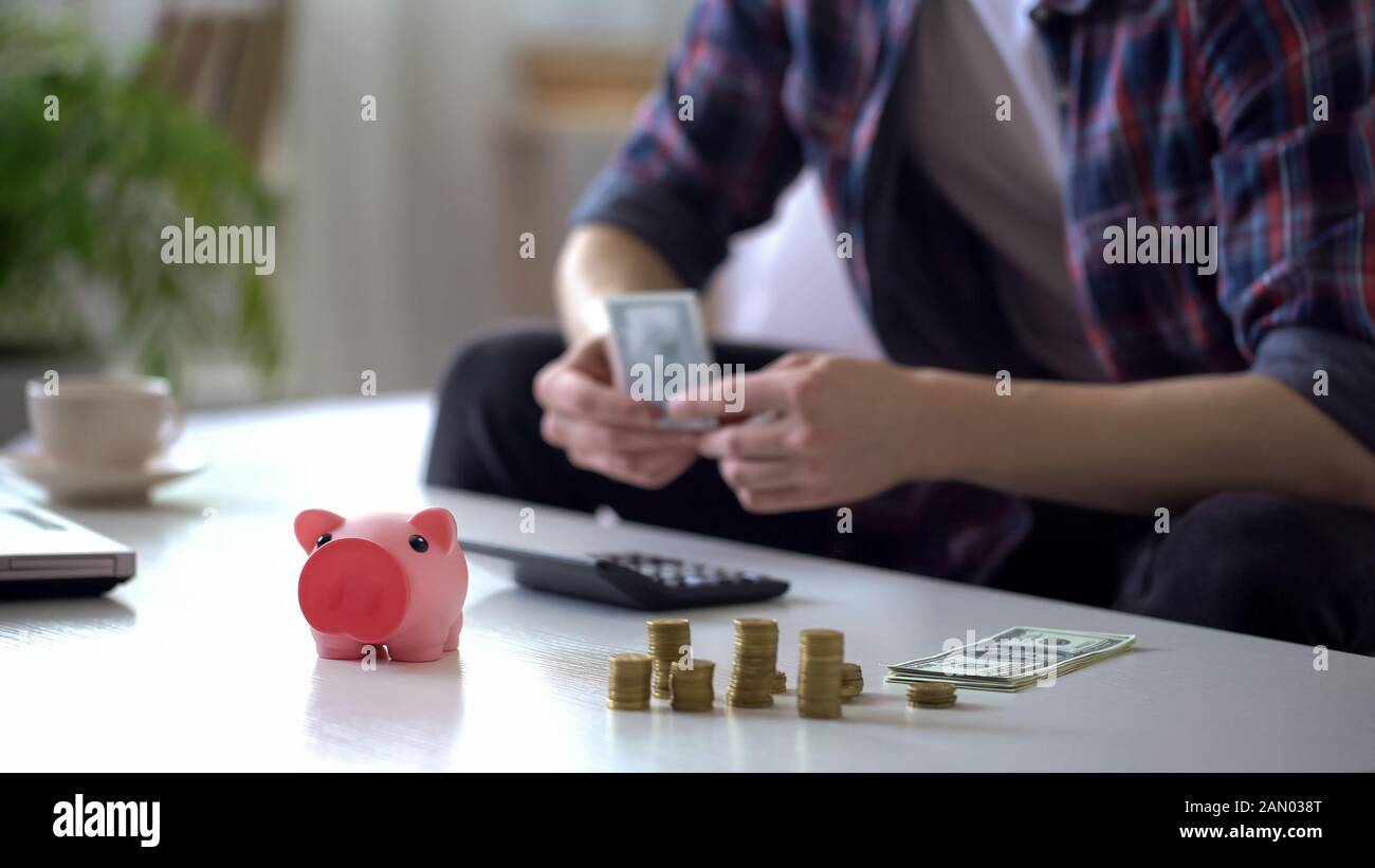 Man hiding money from wife hi-res stock photography and images - Alamy