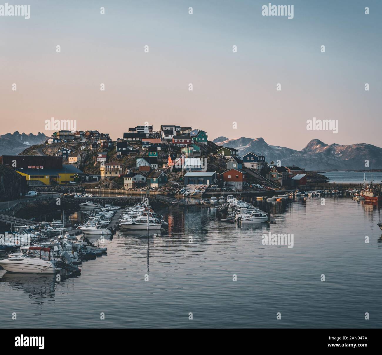 Sunset view of Maniitsoq arctic city in Greenland. Mountains in ...