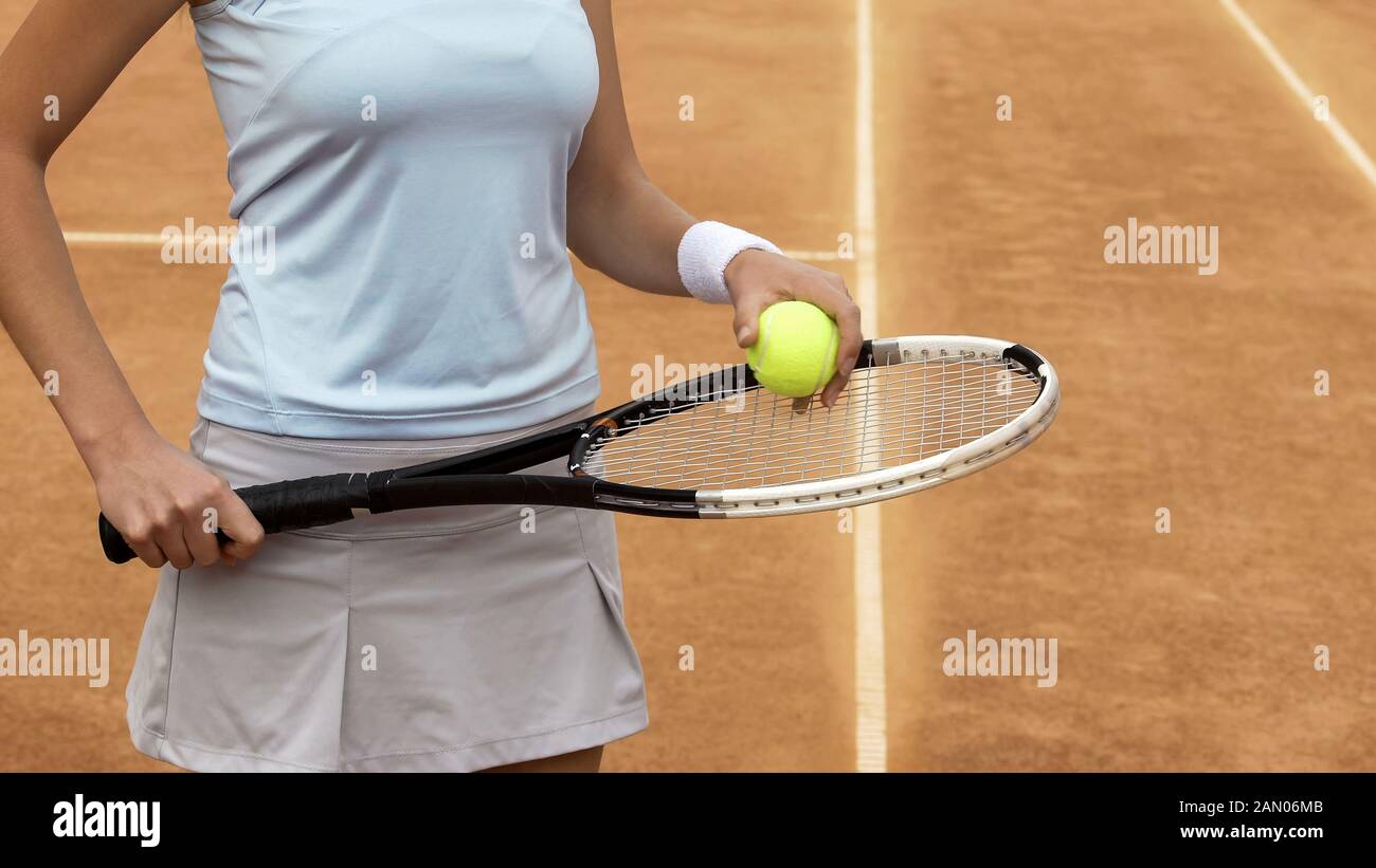 Female tennis player bouncing ball on racket, healthy lifestyle and ...