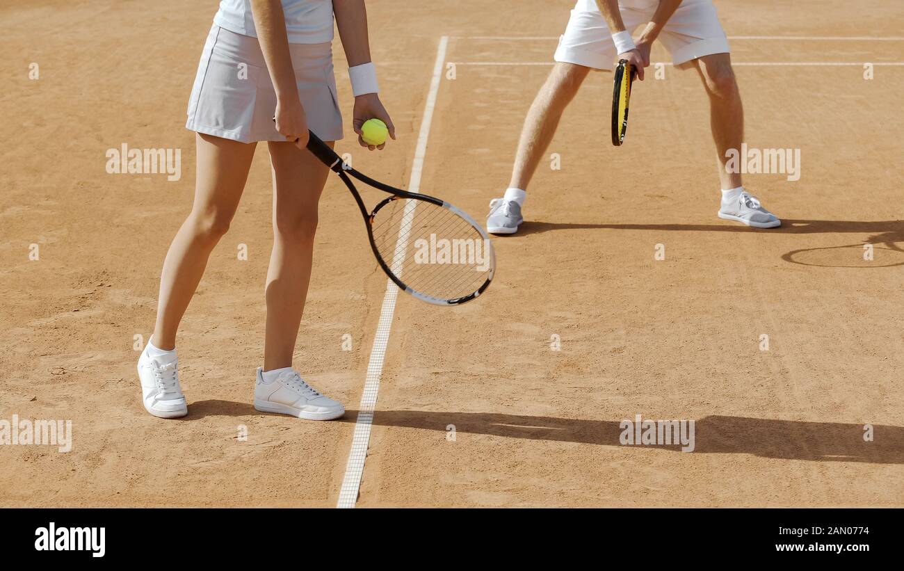 Couple of tennis players preparing to serve ball, sports competition ...