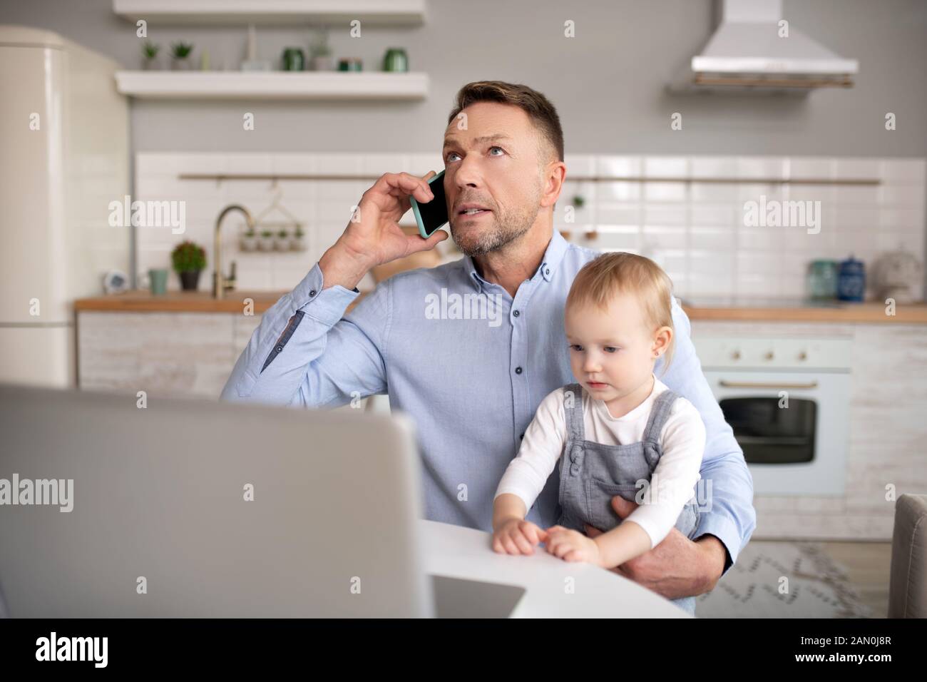 Father baby calling on phone hi-res stock photography and images - Alamy