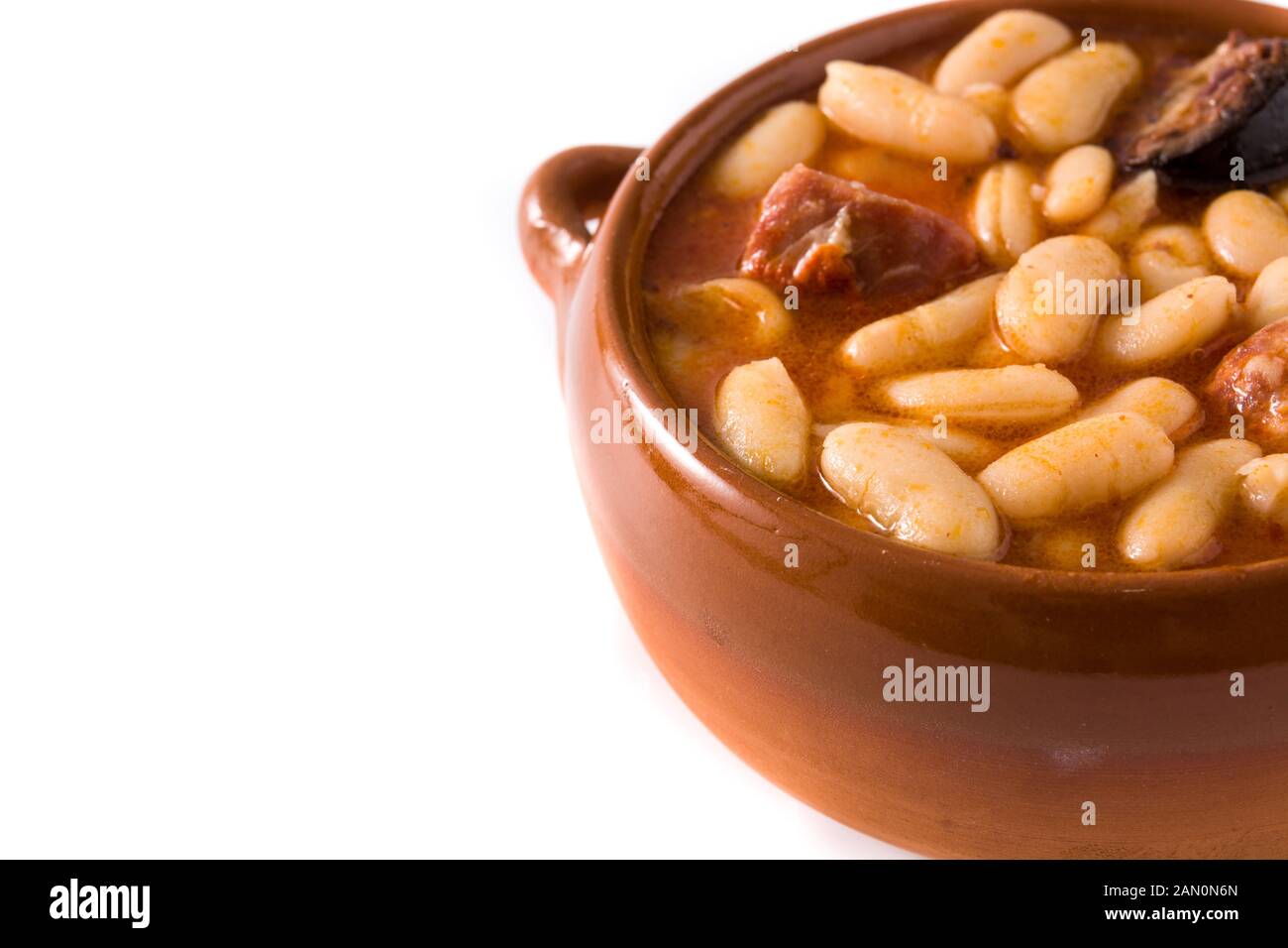 Typical Spanish fabada asturiana isolated on white background. Copy ...