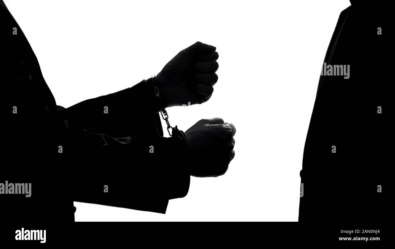Male businessman shadow in handcuffs, corruption punishment, justice ...