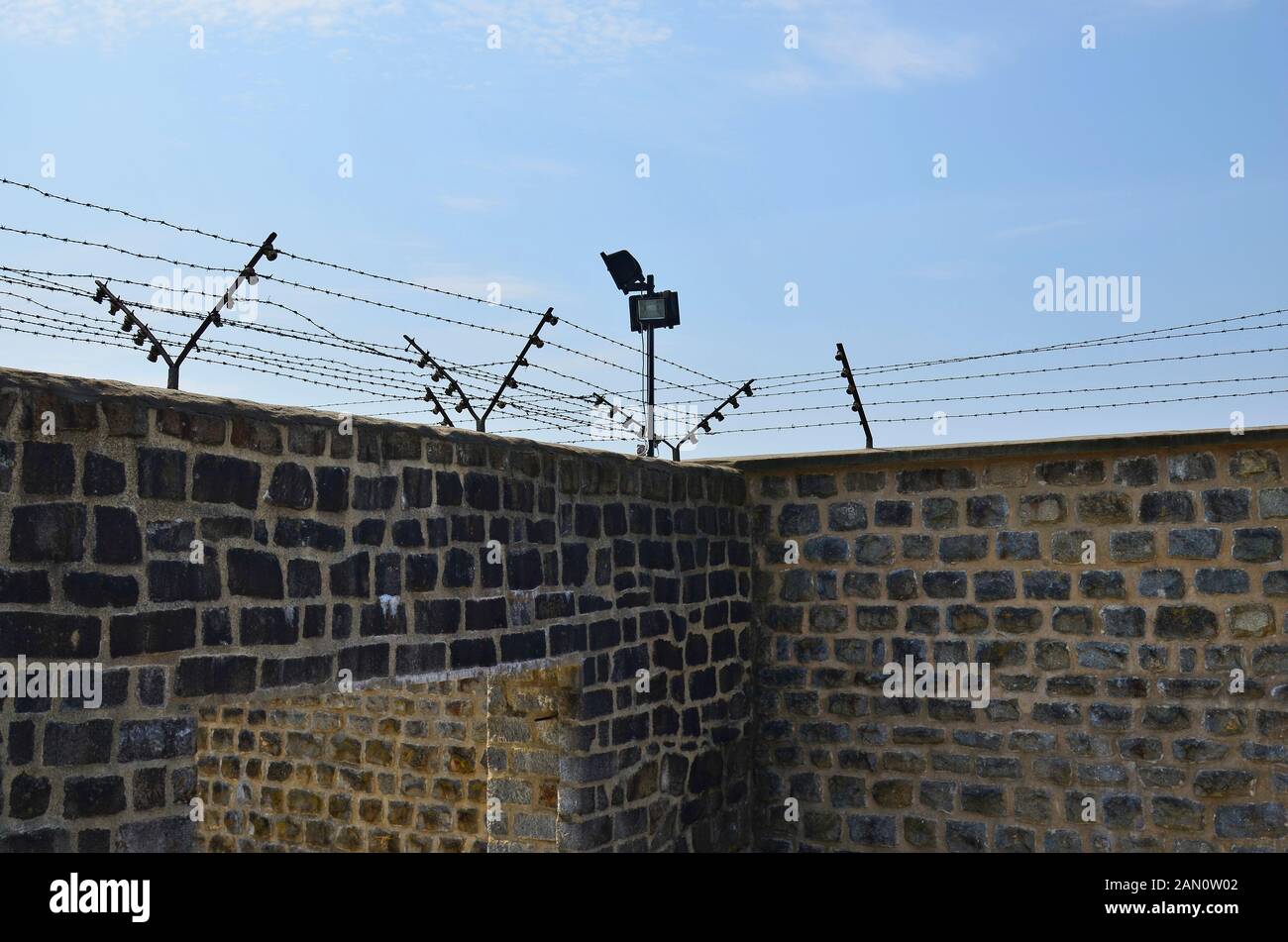 Austria, wall with barbed wire fence in NS concentration camp ...