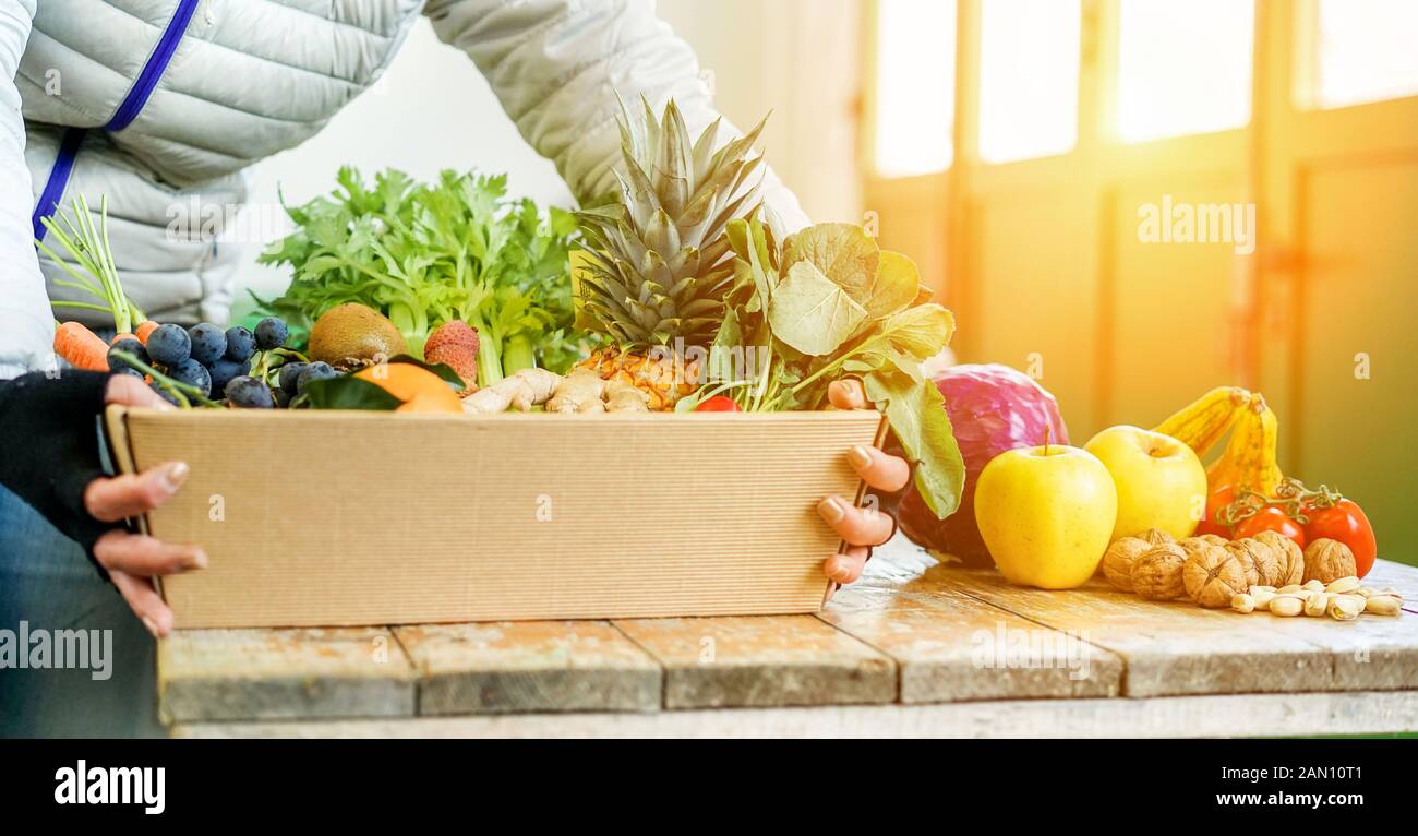 Fruit seller woman with different fruits and vegetables in shop ...