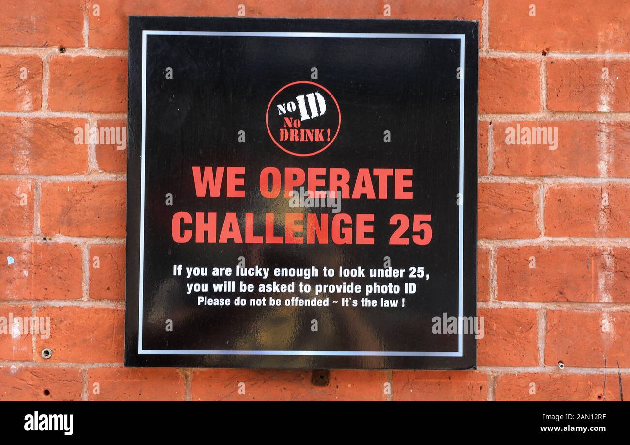 A sign saying "we operate challenge 25", an anti drinking scheme in the ...