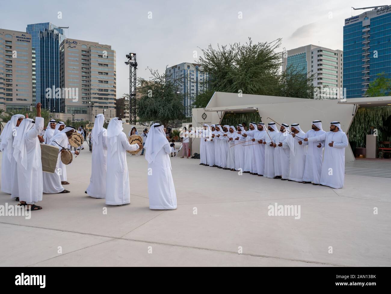 Middle Eastern Culture - Emirati Men performing Al Ayala traditional ...