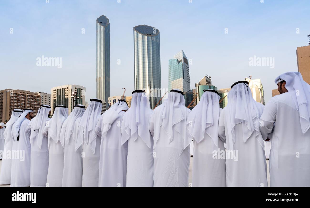 Emirati Men performing the Yowla, a traditional dance in the heritage ...