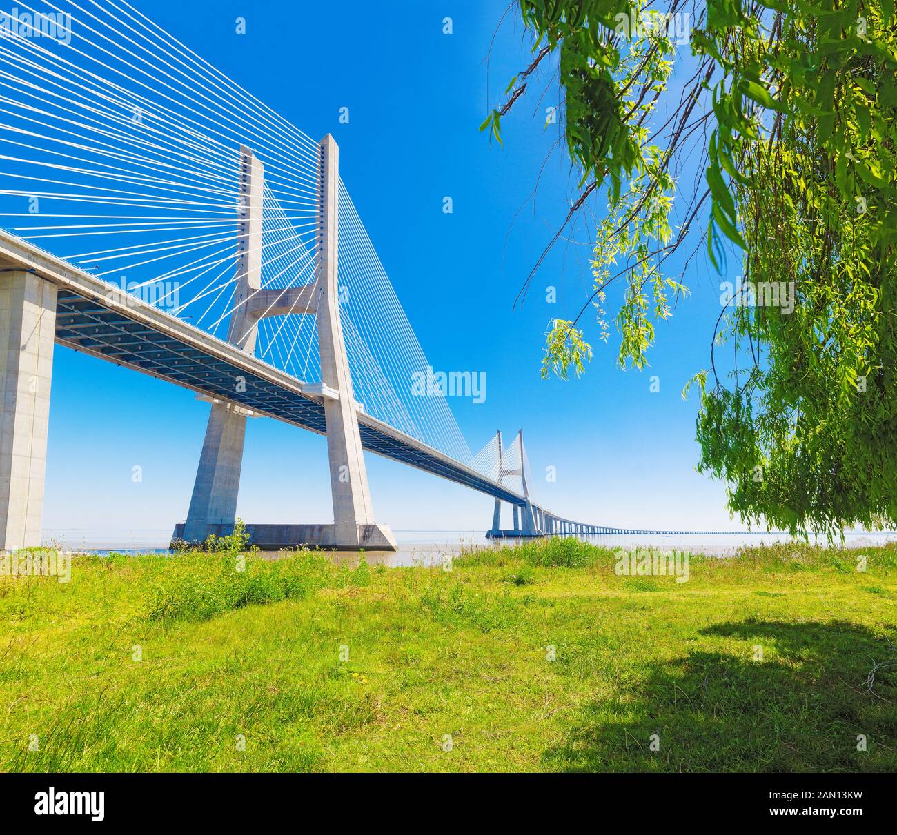 Modern bridge and architecture with nature and blue sky. Vasco da Gama ...