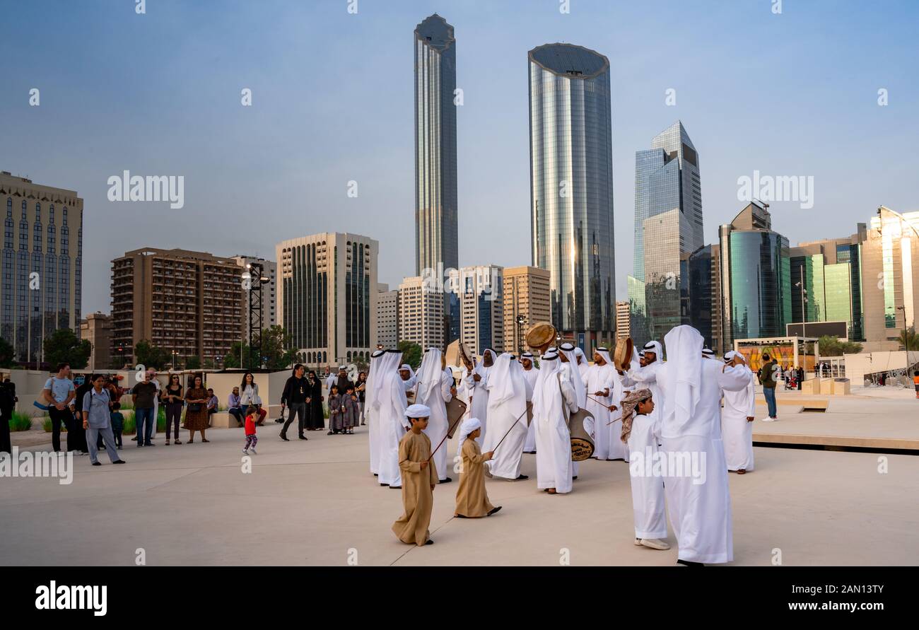 Middle Eastern Culture - Emirati Men performing Al Ayala traditional ...