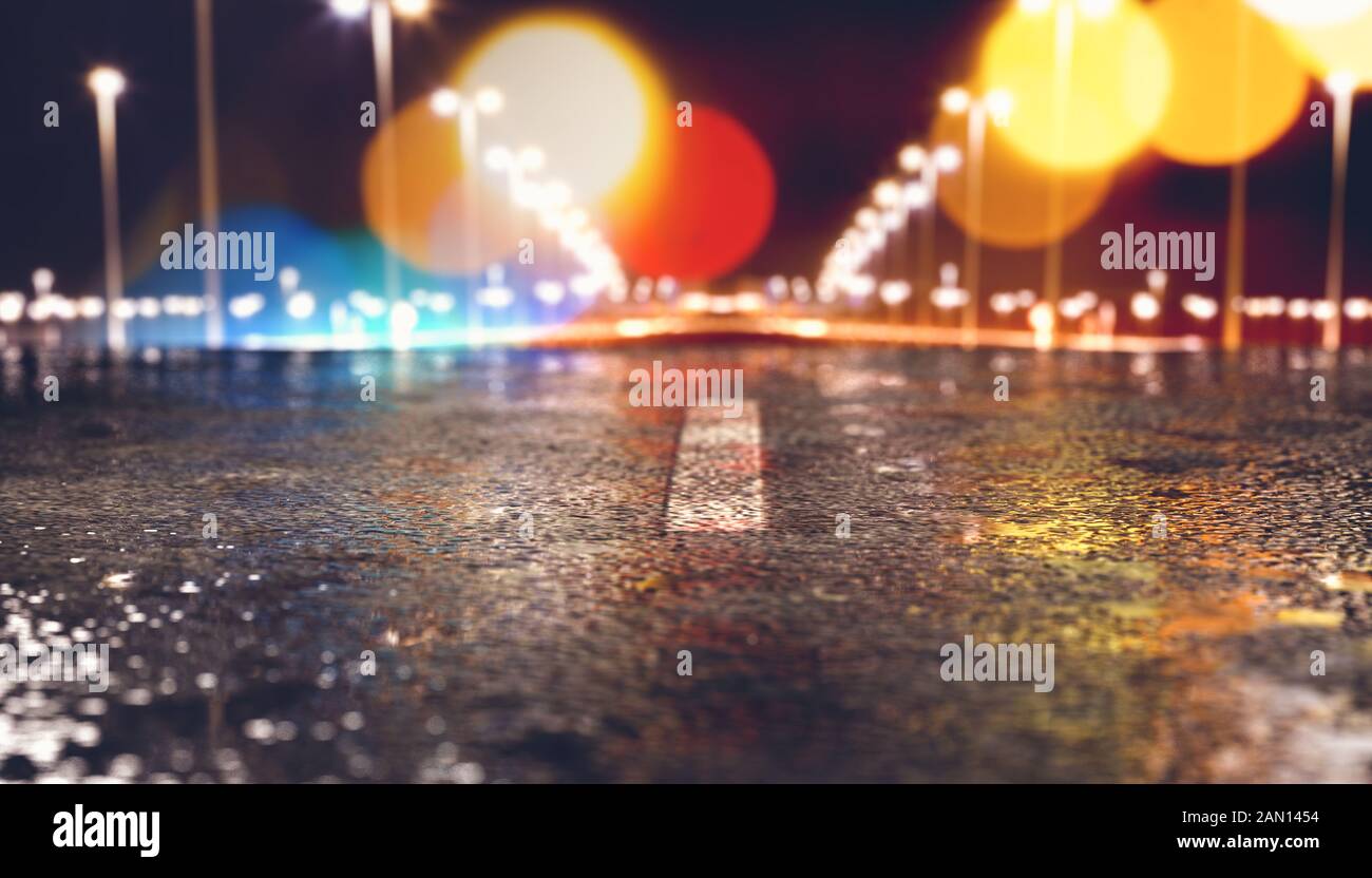 Street cement and concrete floor and lights.Urban cityscape.Puddles on ...