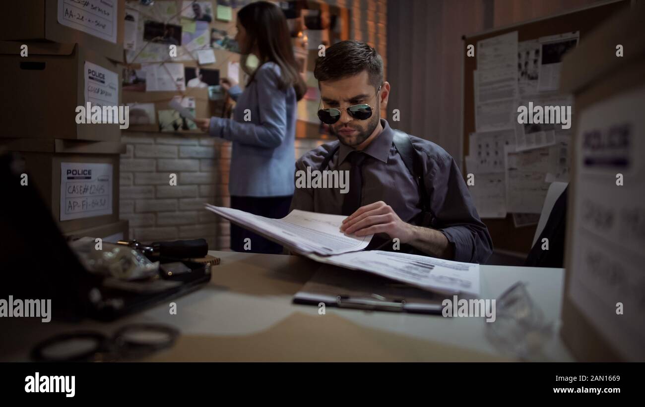 Private detective working criminal information hi-res stock photography ...