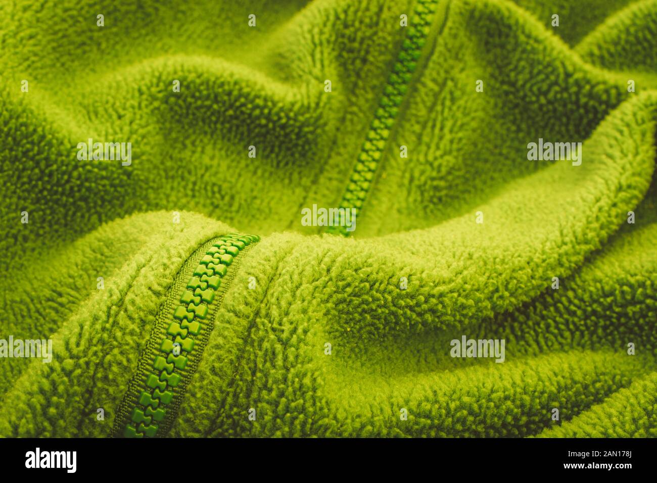 Close up shot of a YKK plastic zip fastener / zipper on fleece jacket ...