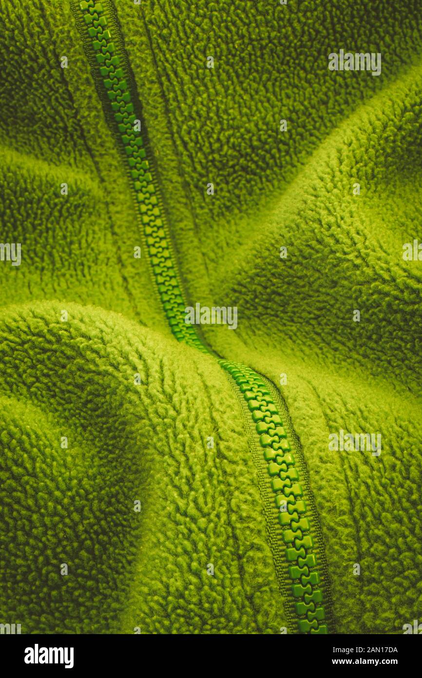 Close up shot of a YKK plastic zip fastener / zipper on fleece jacket ...