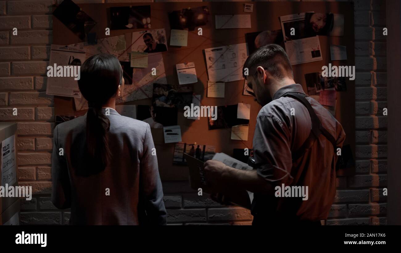 Genius detectives analyzing press clipping and photo information about ...