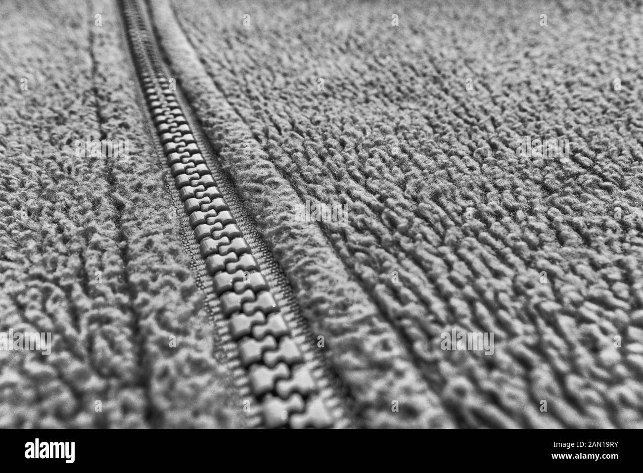 Mono close up, ultra-wide macro shot YKK plastic zip fastener / zipper ...