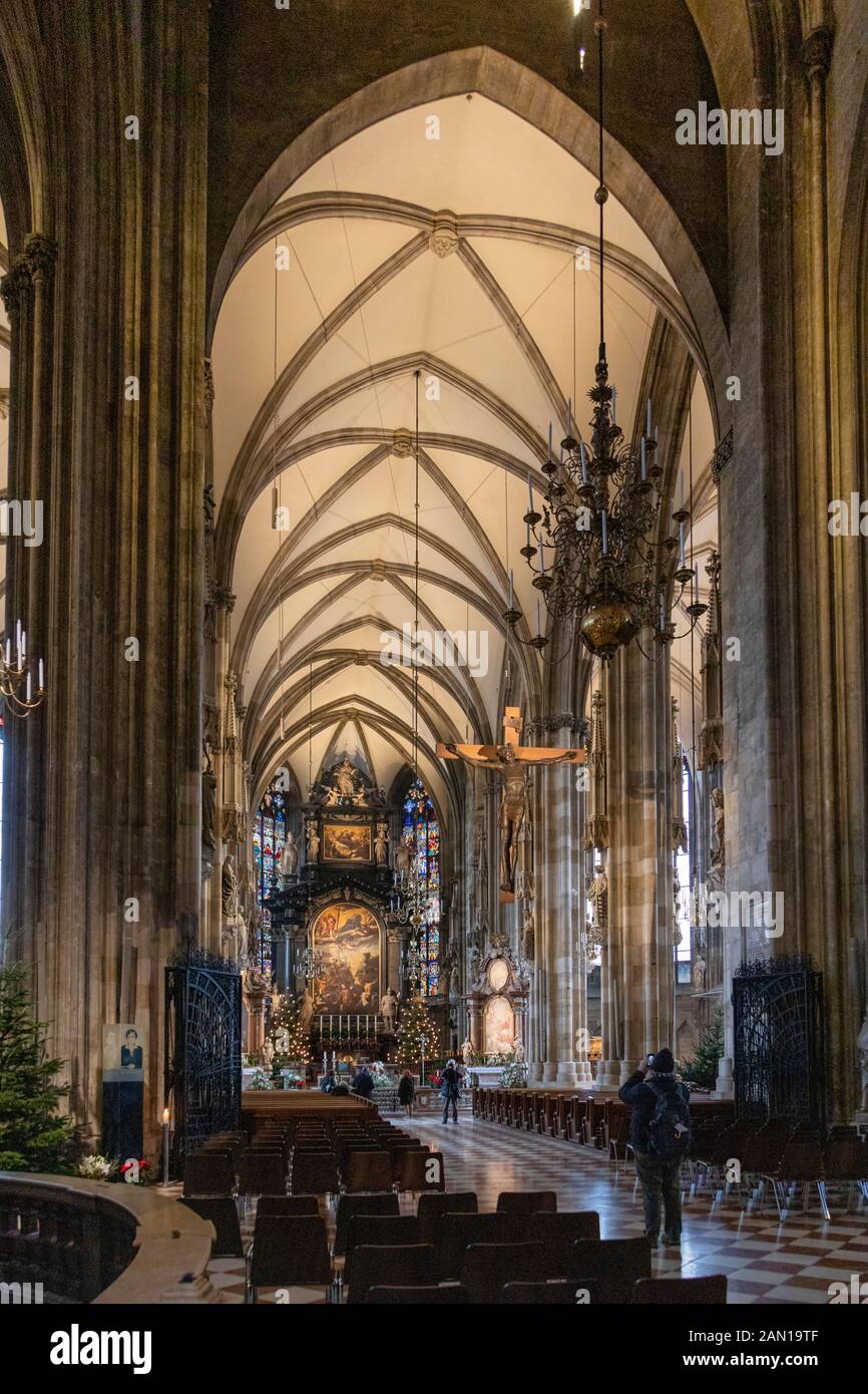VIENNA, AUSTRIA - DECEMBER 30: A tourist takes a photo of the main ...
