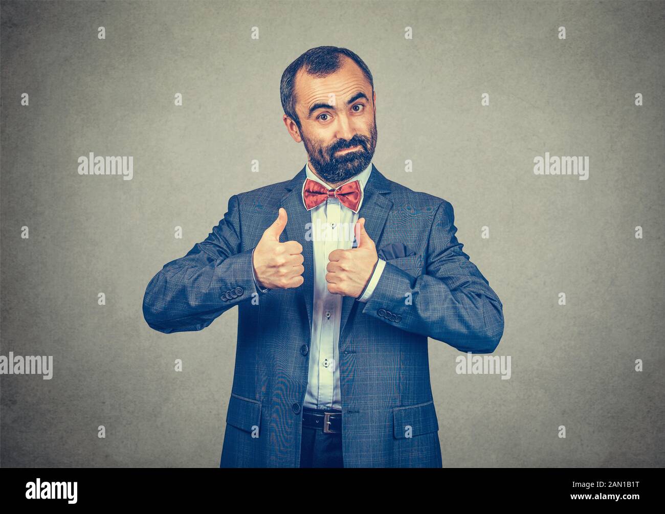Happy man giving thumbs up sign like hands gesture. Hipster male with ...