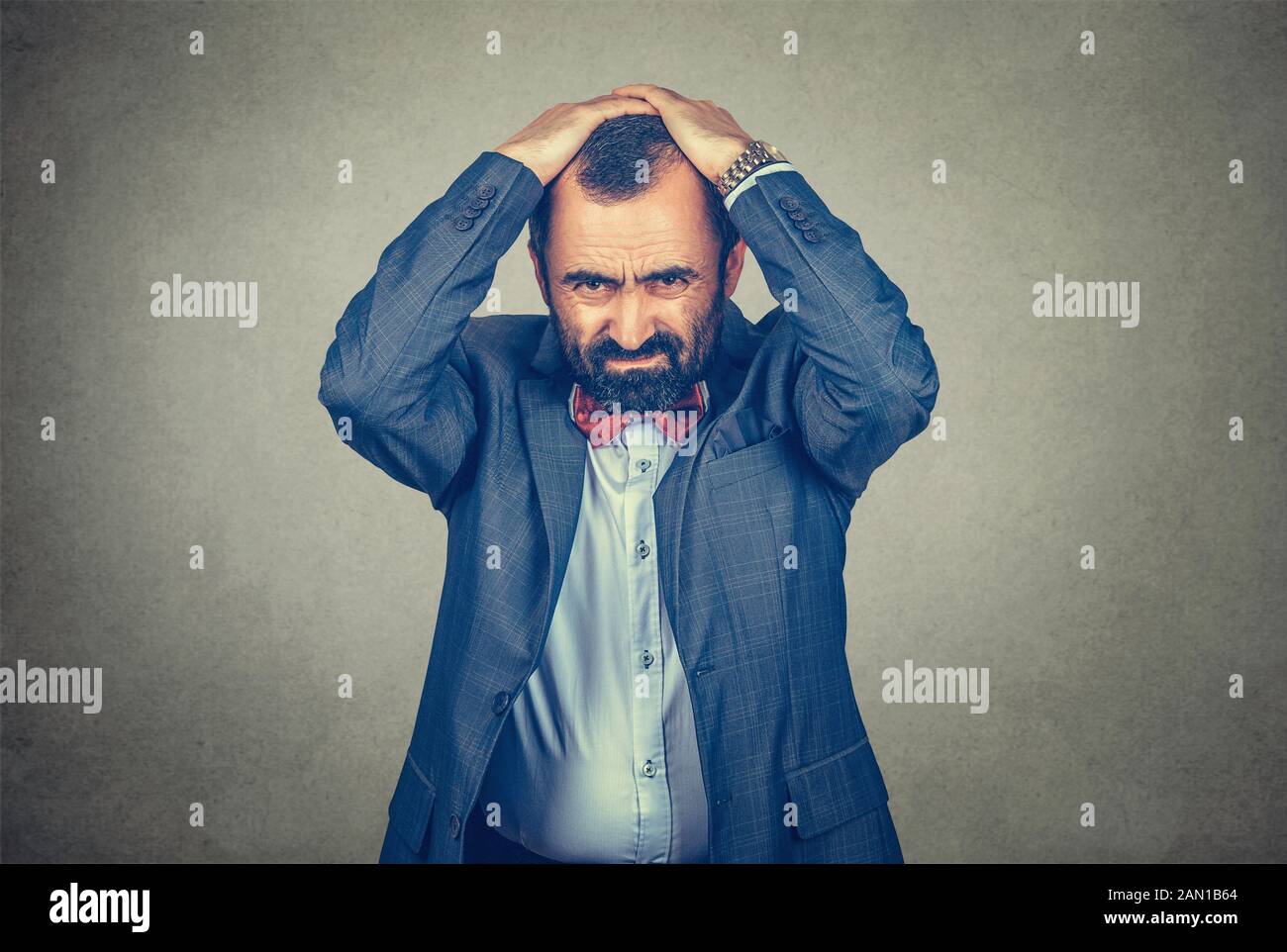 businessman holding hands on head in frustration, stressed man upset ...