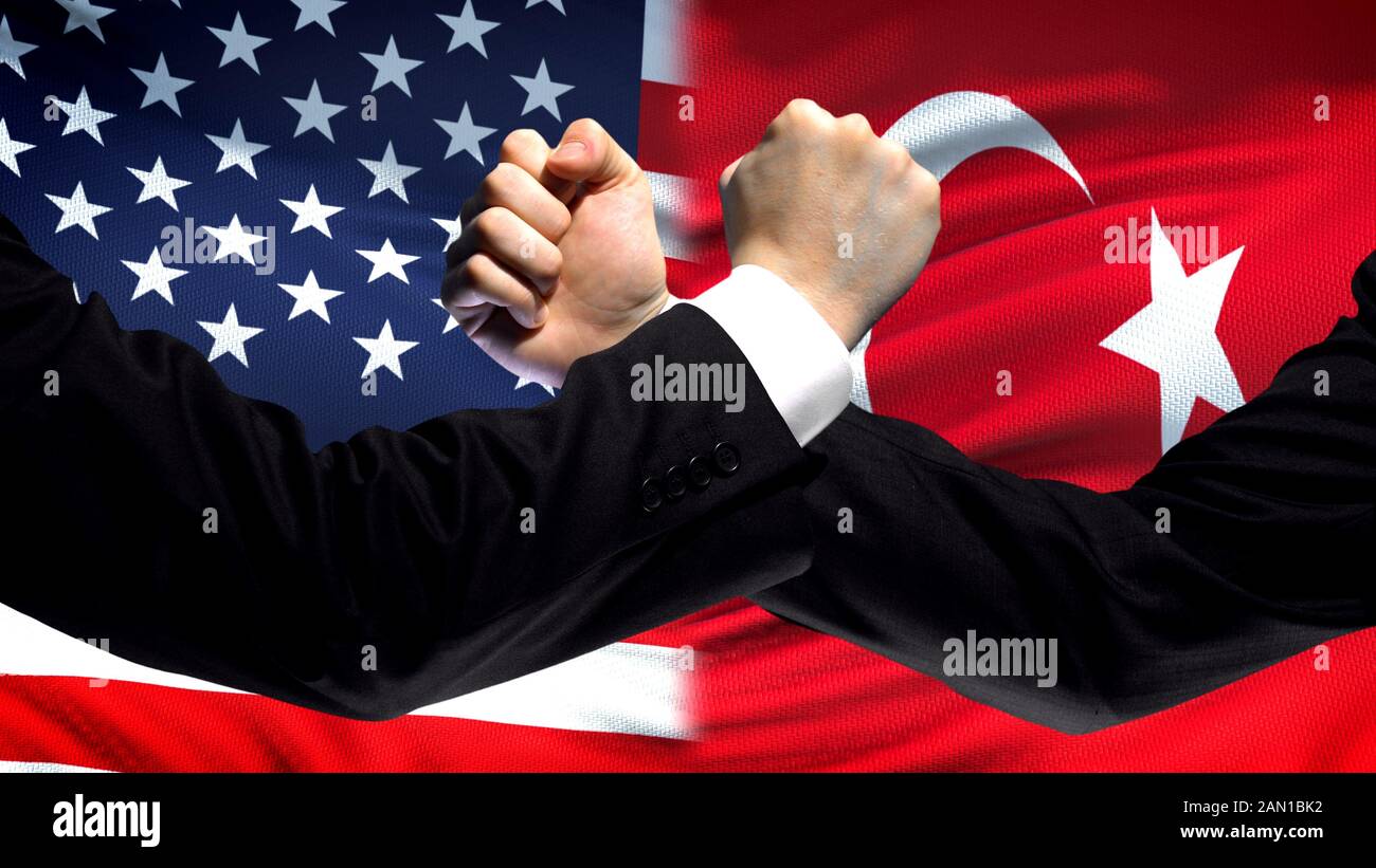 US vs Turkey confrontation, countries disagreement, fists on flag ...