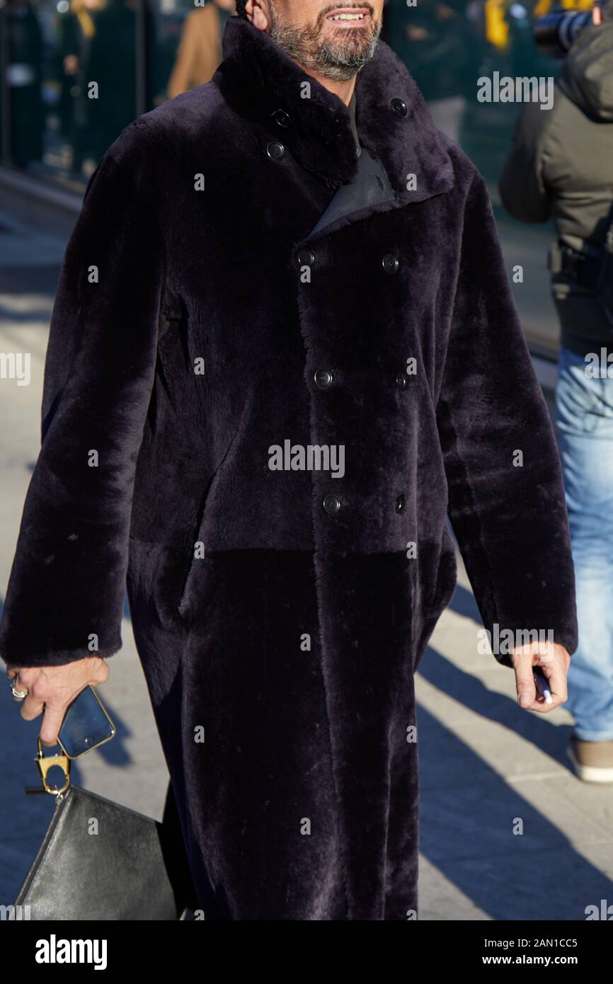 MILAN, ITALY - JANUARY 11, 2019: Man with black fur coat before Emporio ...