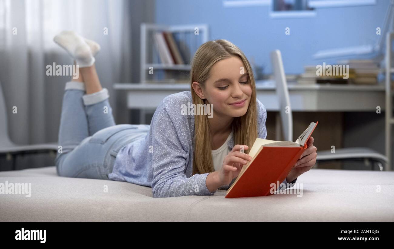 Cute girl enjoying romantic poems, reading book, dreaming of perfect ...