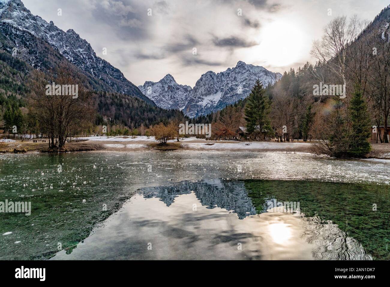 Kranjska Gora frozen Jasna lake at sunset in winter season Stock Photo ...