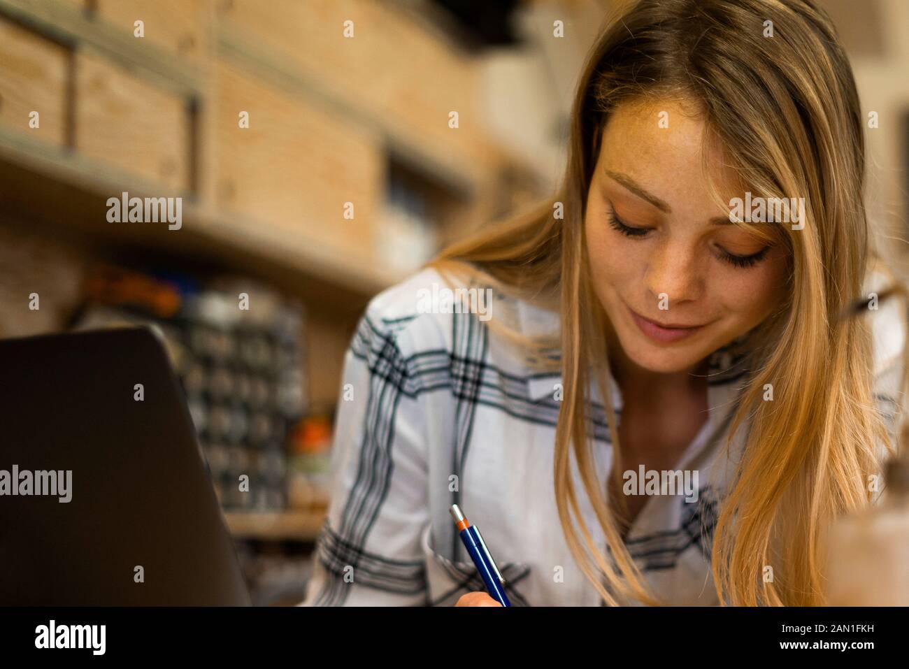 Woman working on laptop writing hi-res stock photography and images - Alamy