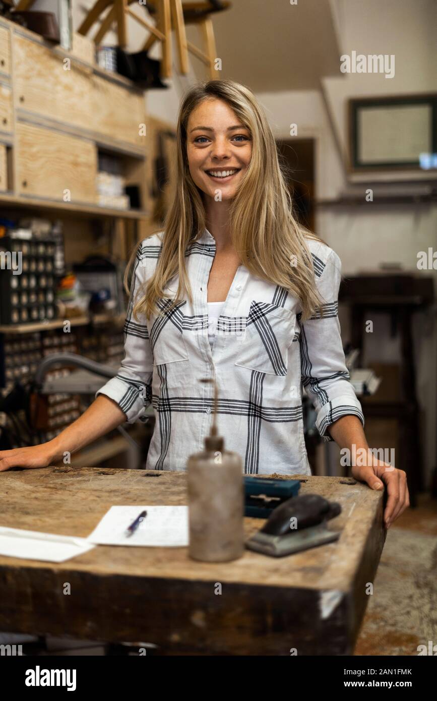 Portrait woman standing table hi-res stock photography and images - Alamy