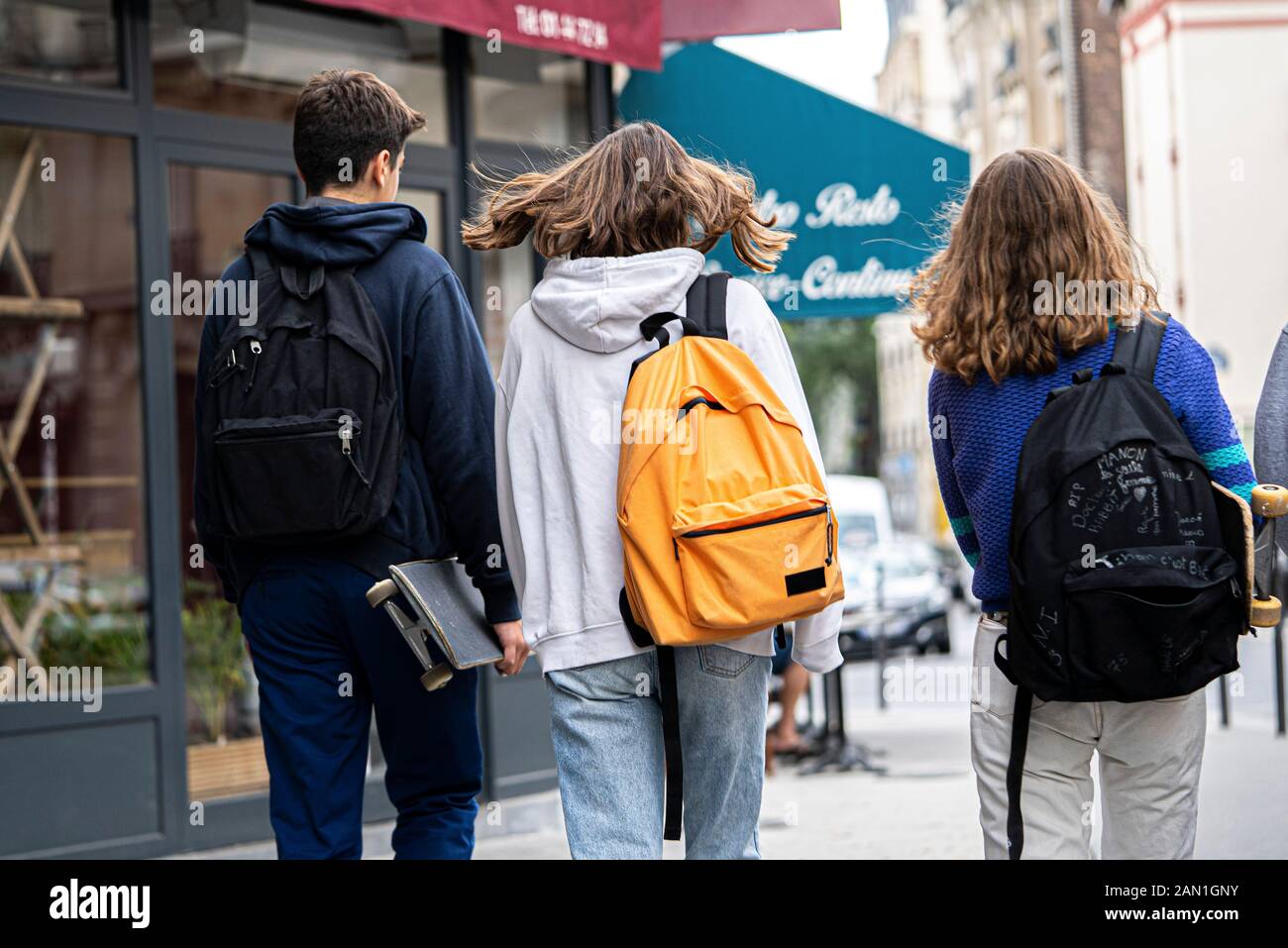 Friends walking on street Stock Photo - Alamy