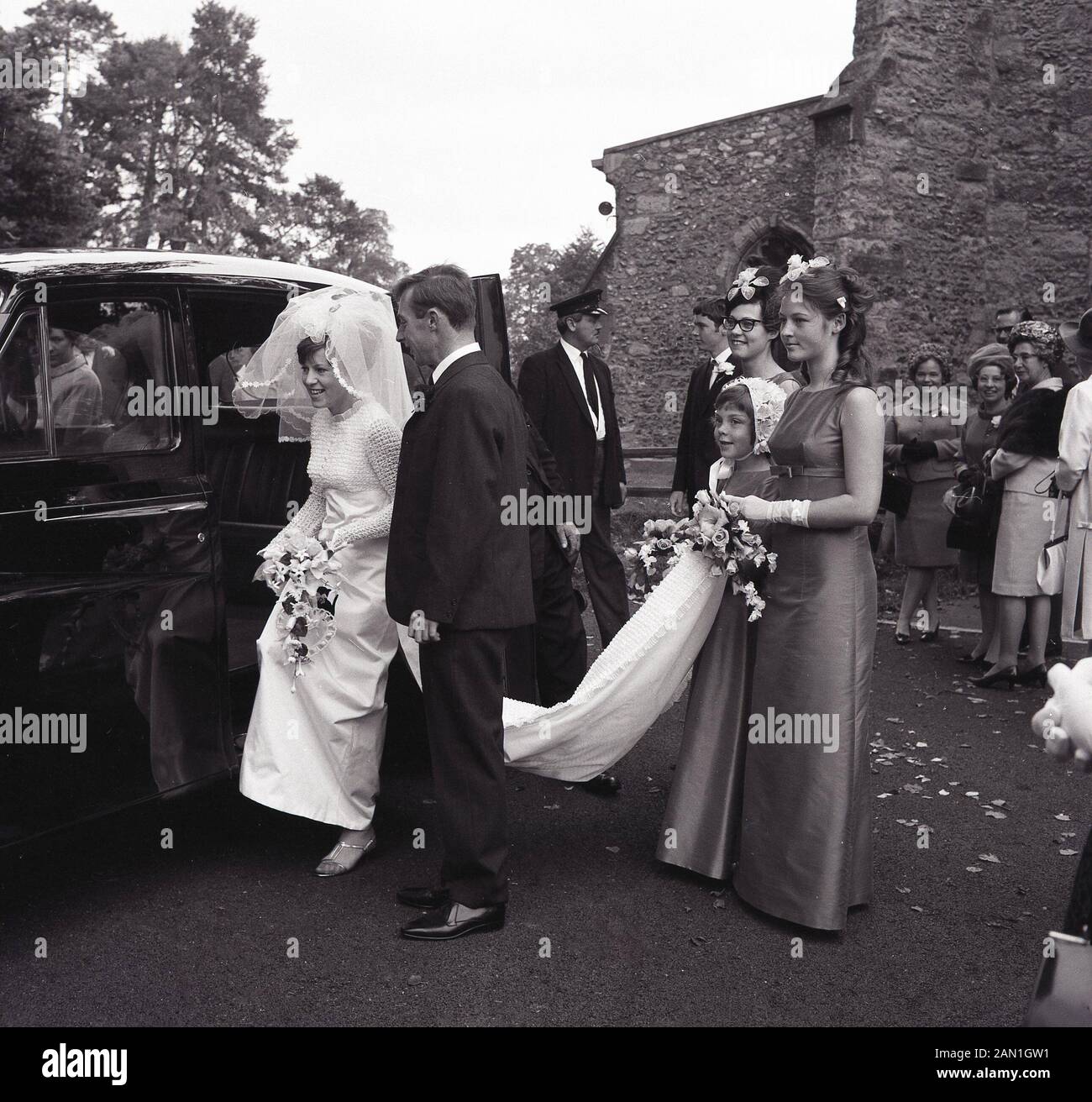 1967, historical, bride and groom getting into the back of a wedding ...