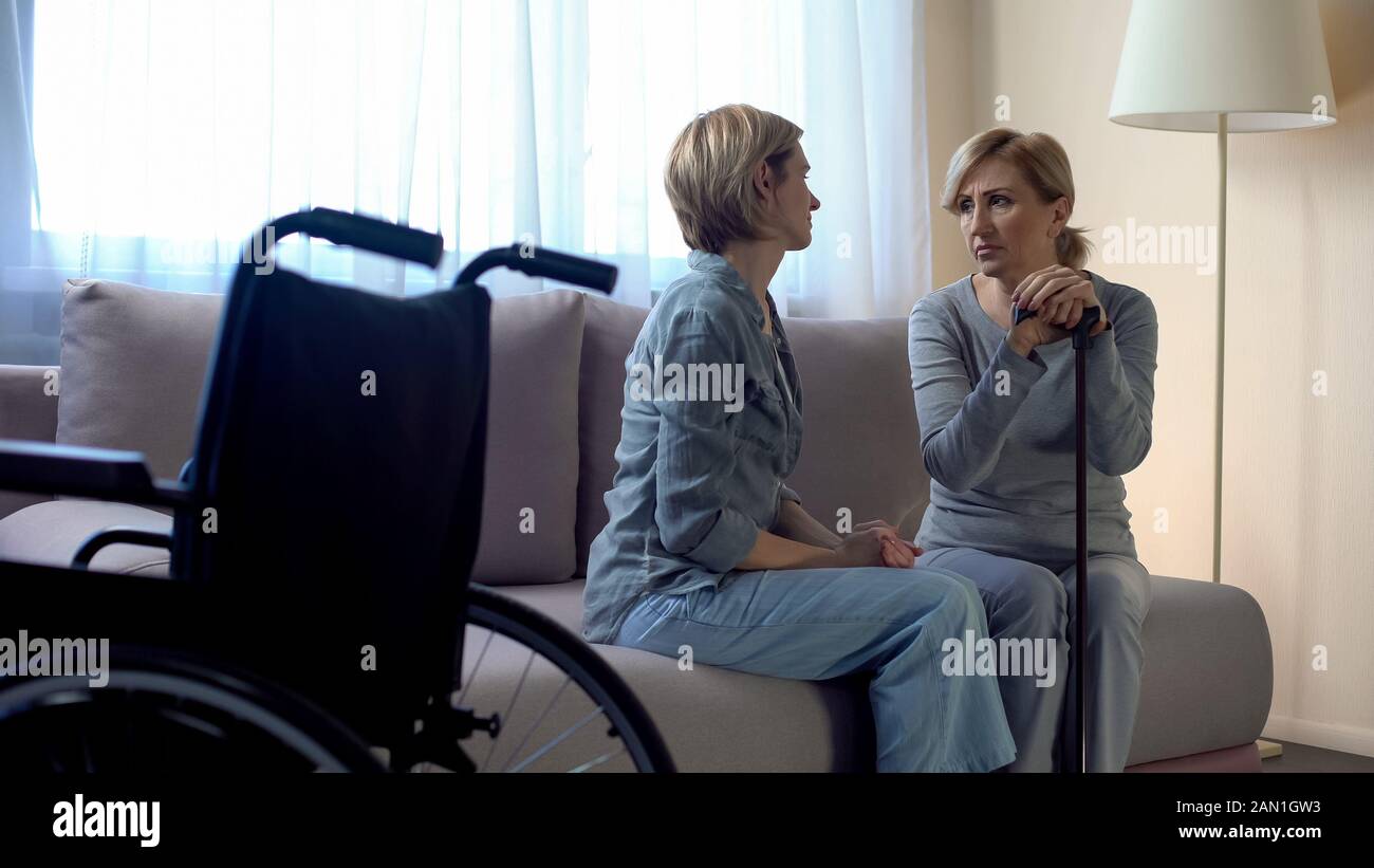 Female volunteer supporting sad elderly hi-res stock photography and ...