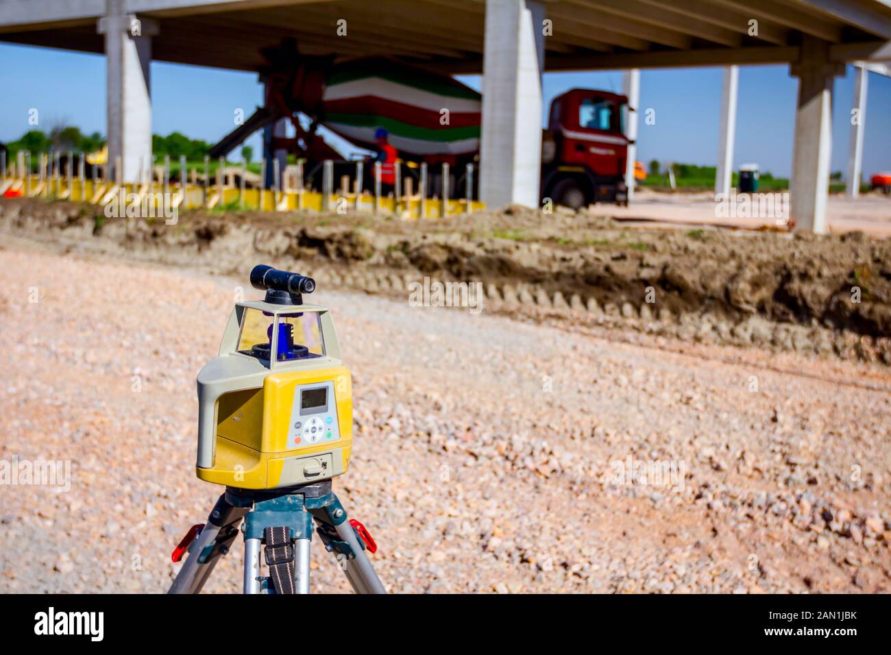 Total center device on tripod with laser for leveling other devices to ...